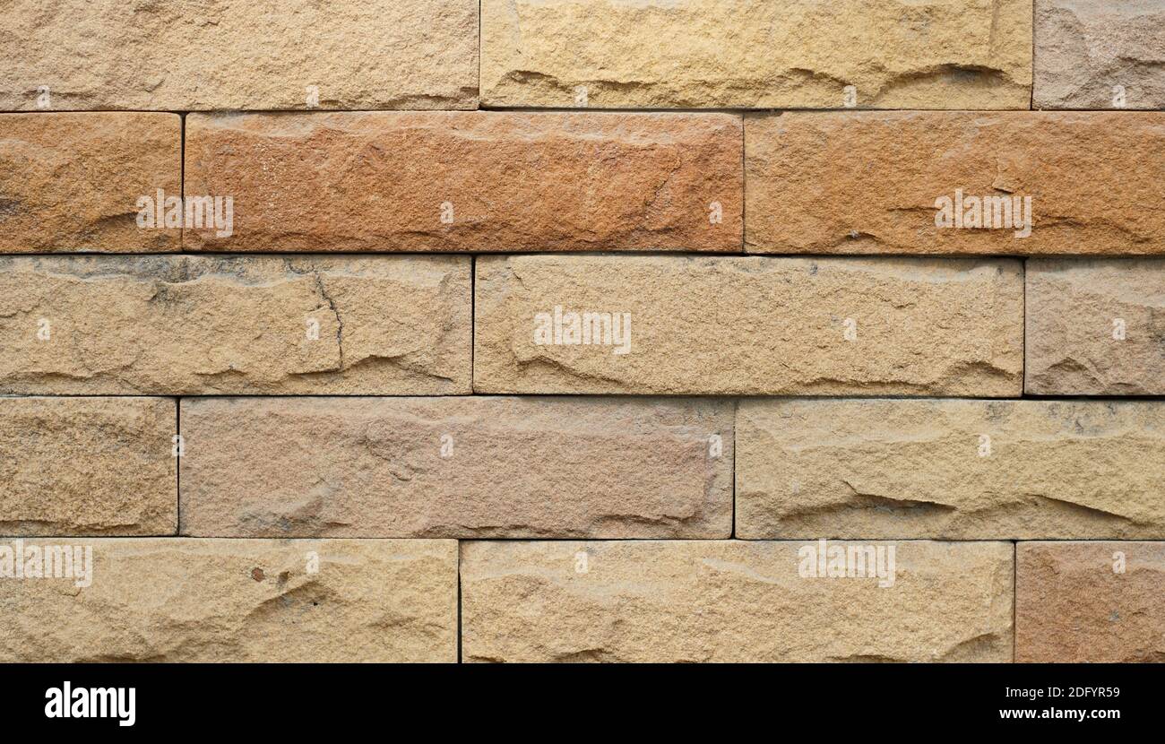 A texture of a bricks layer of a vintage fence style Stock Photo - Alamy
