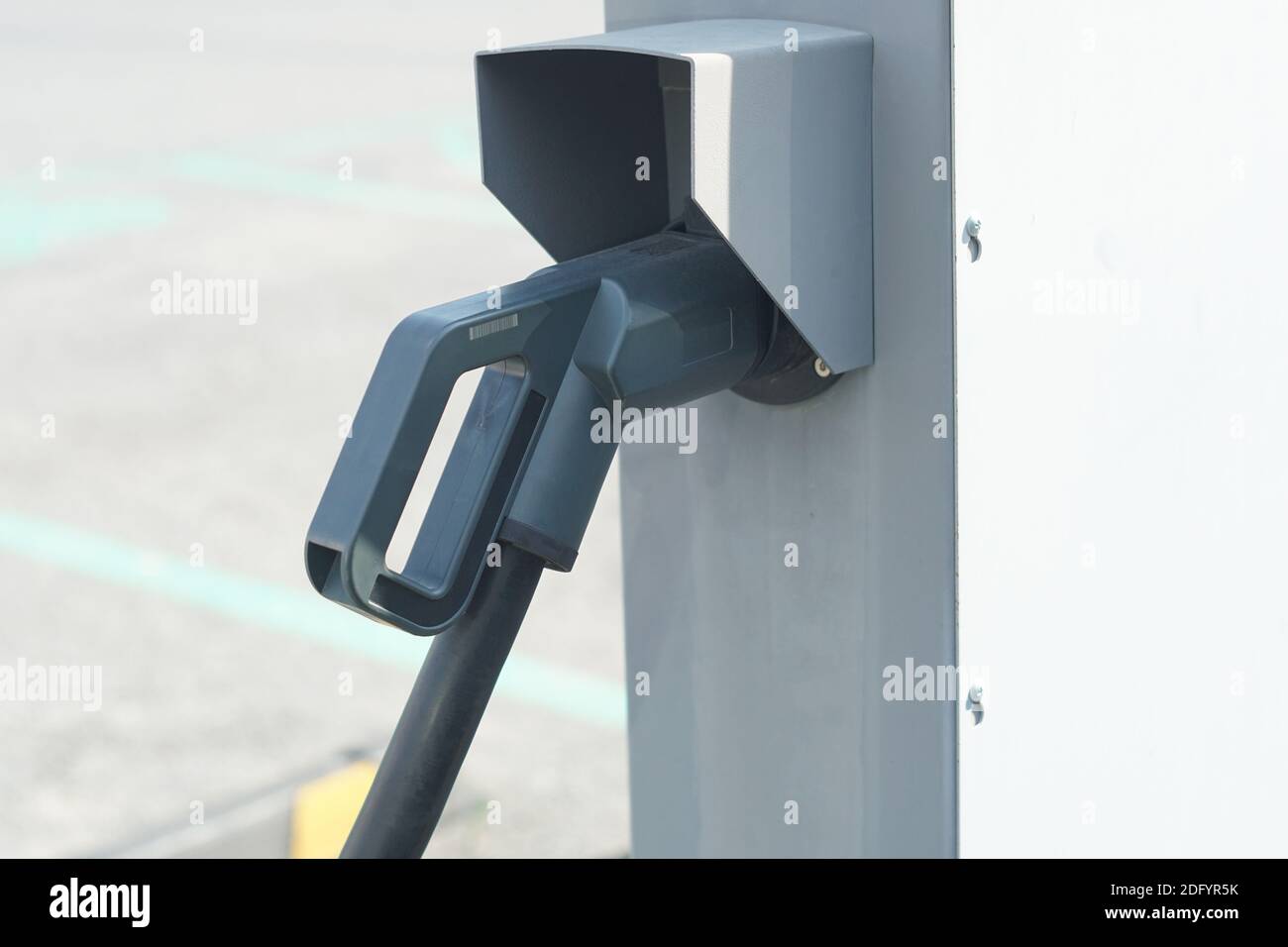 Close-Up a side veiw of a black head of EV Charger for automobile ...