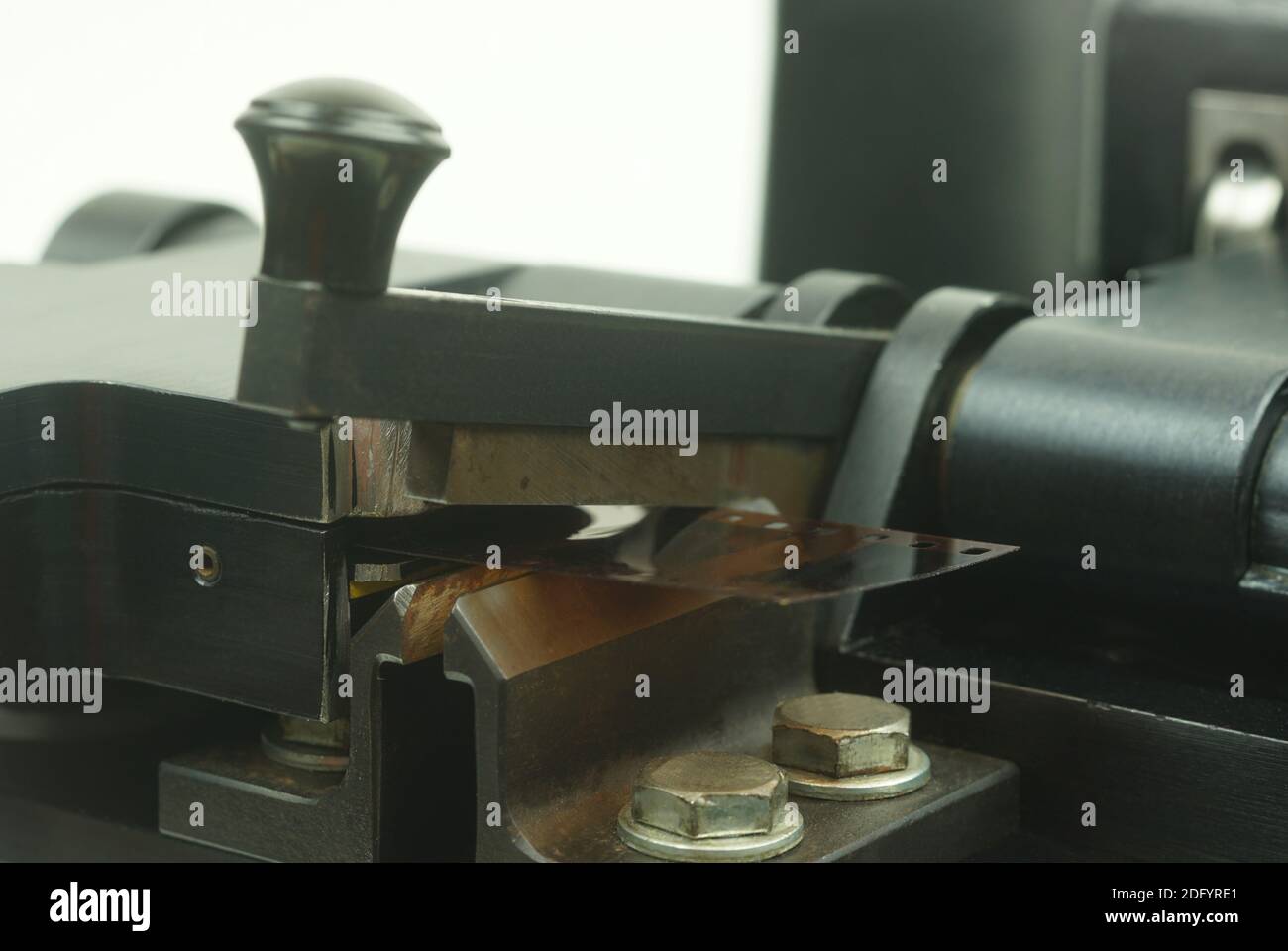 Close-Up cutting a negative film for ultrasonic film spicer joiner ...