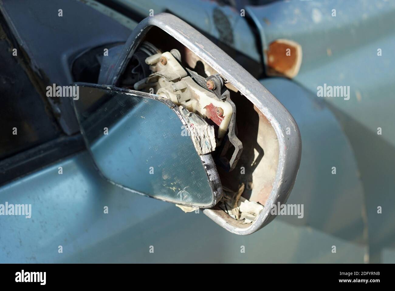 A damage and decay of a side mirror of old car Stock Photo - Alamy