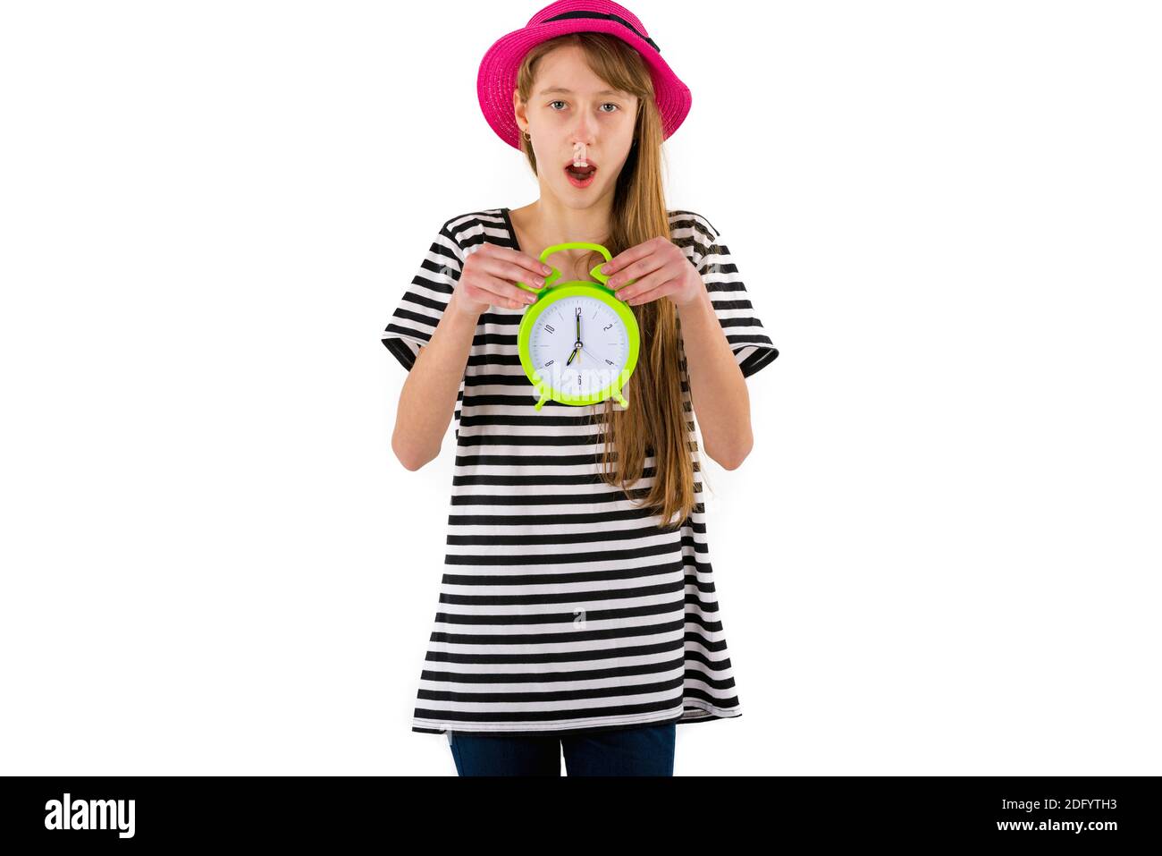 Sleepy Teen Girl holding alarm Clock, isolated on white background ...