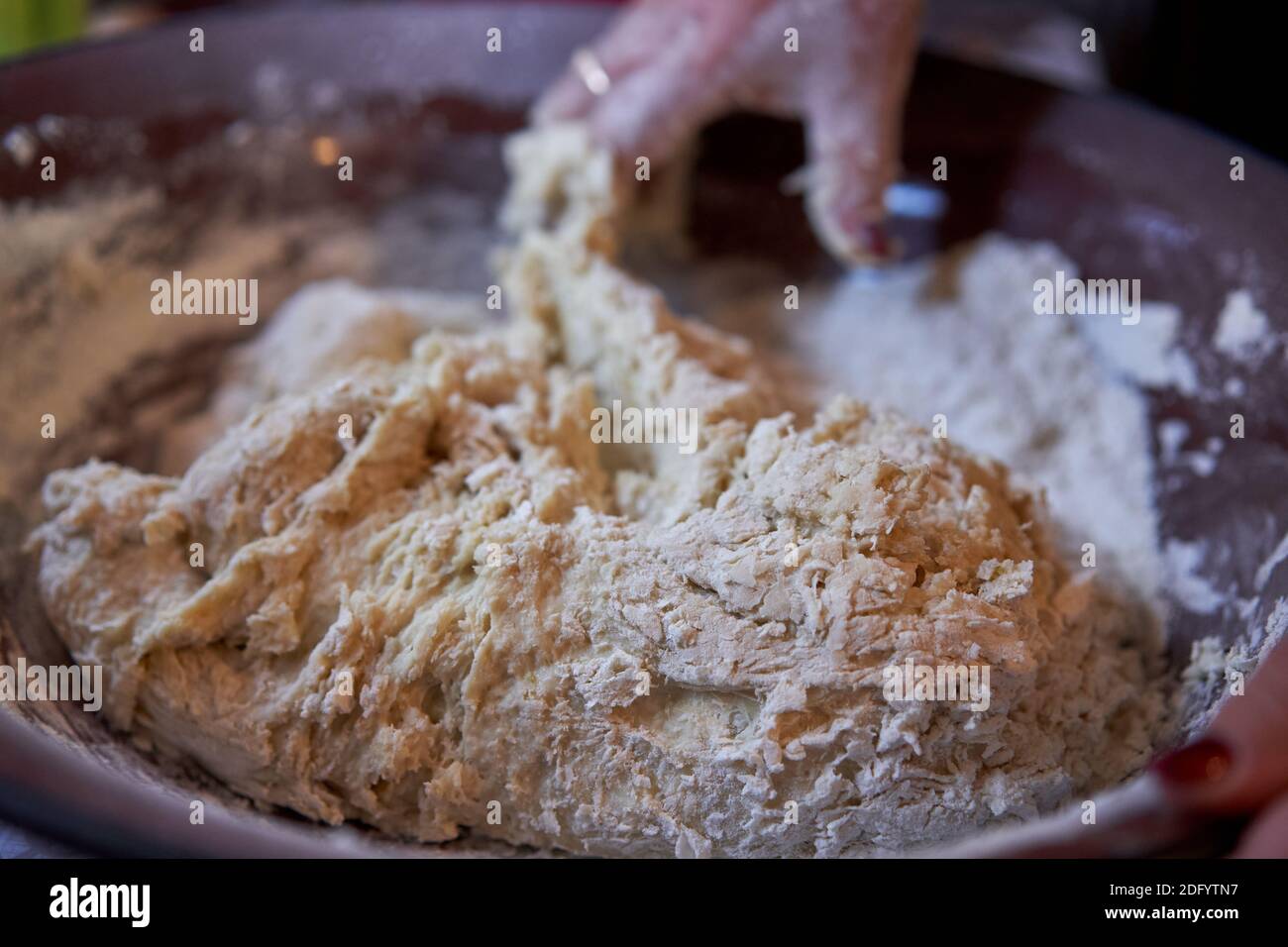 Anonymous chef making and kneading a cake dough Stock Photo - Alamy