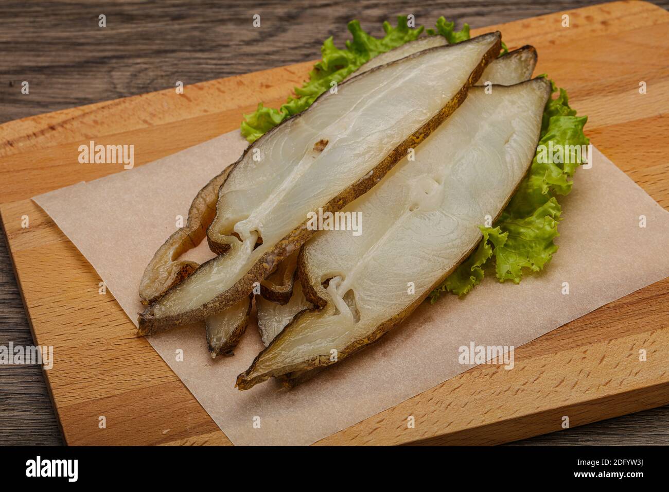 Delicous smoked halibut fish slices snack Stock Photo - Alamy
