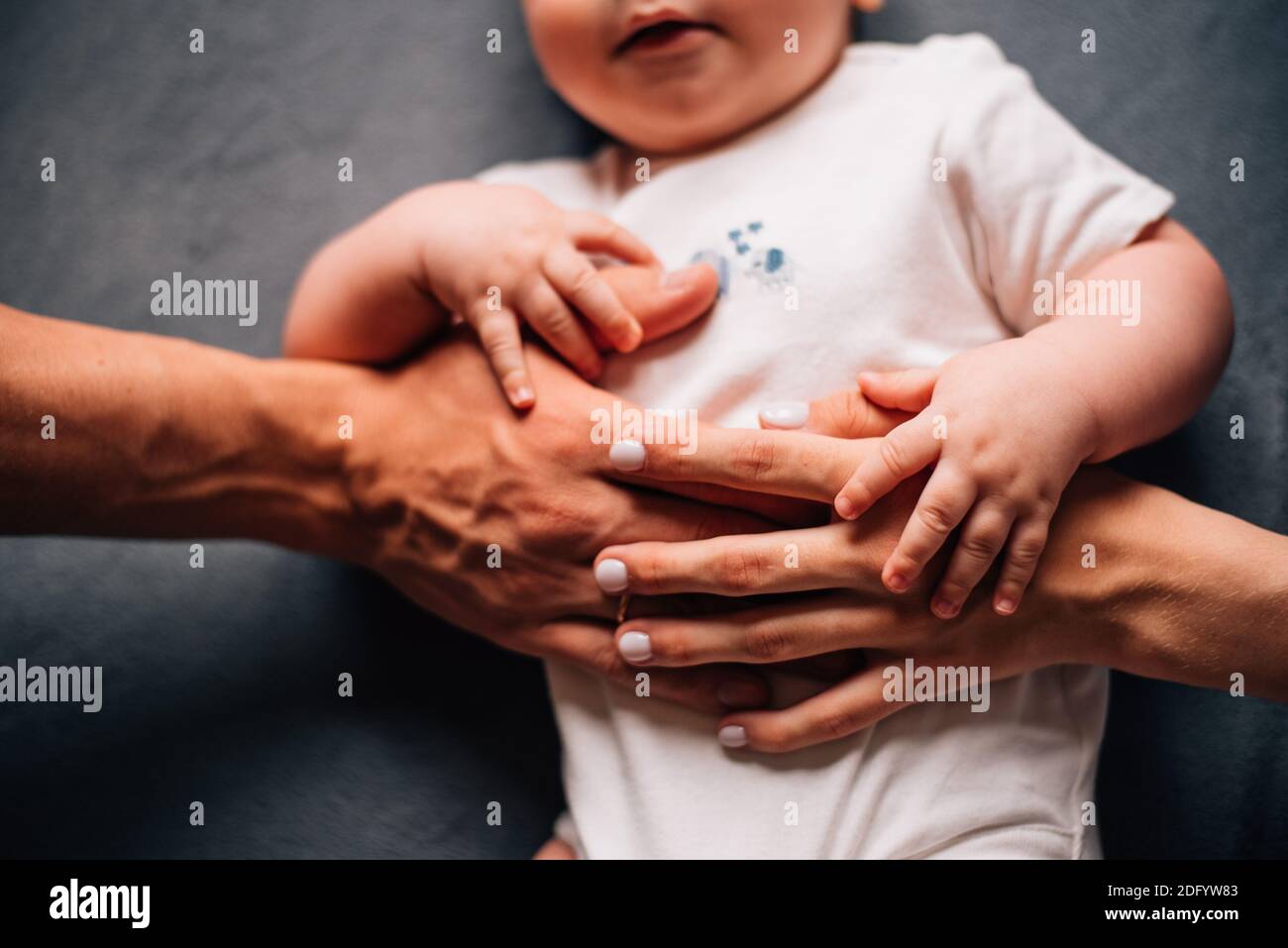 a small child crawls in his arms to the parent Stock Photo - Alamy