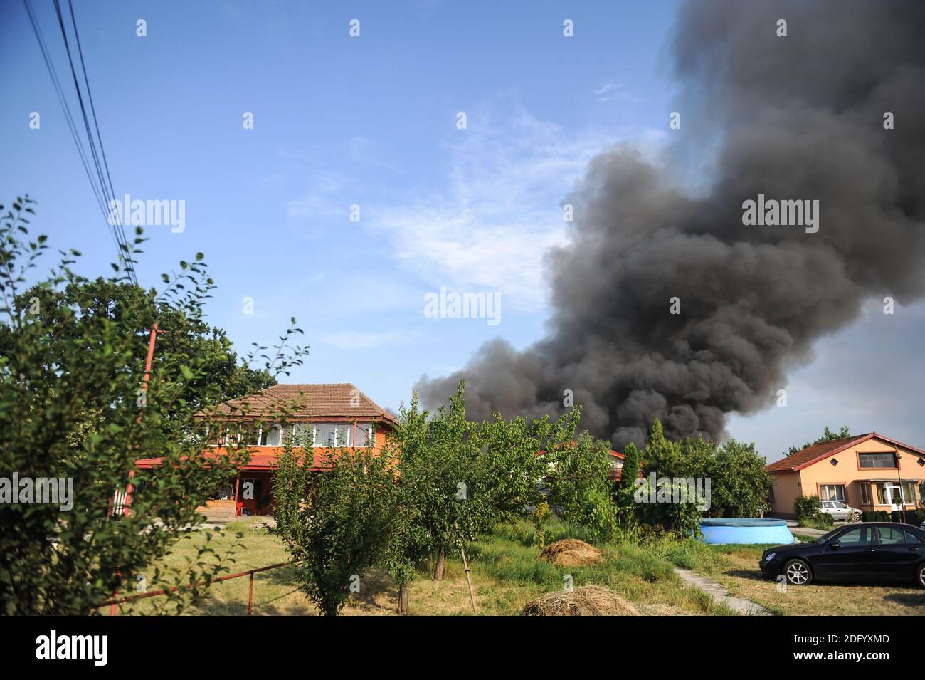 Bucharest, Romania - July 7, 2012: Firefighters try to extinguish the ...