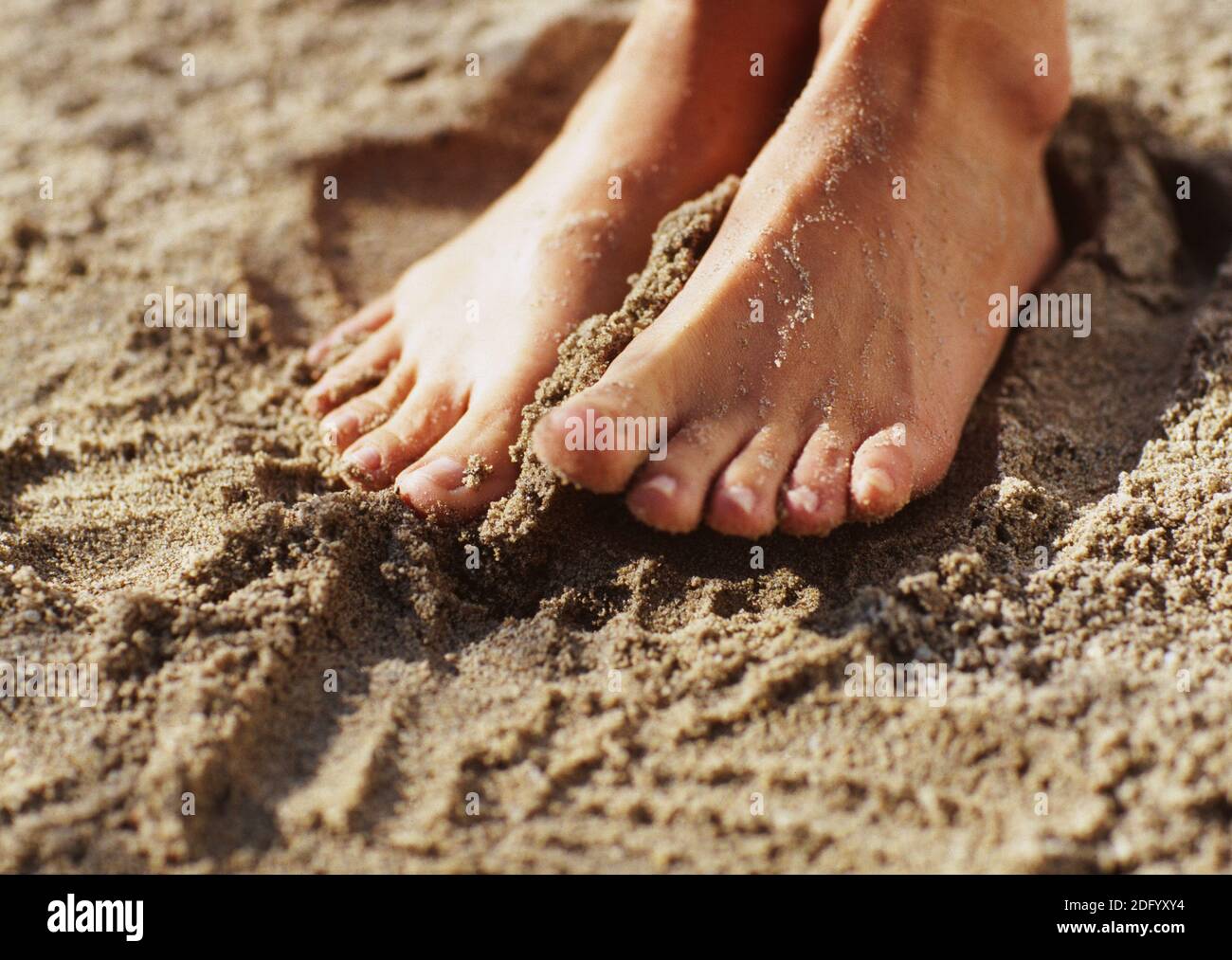 Feet in the sand hi-res stock photography and images - Alamy
