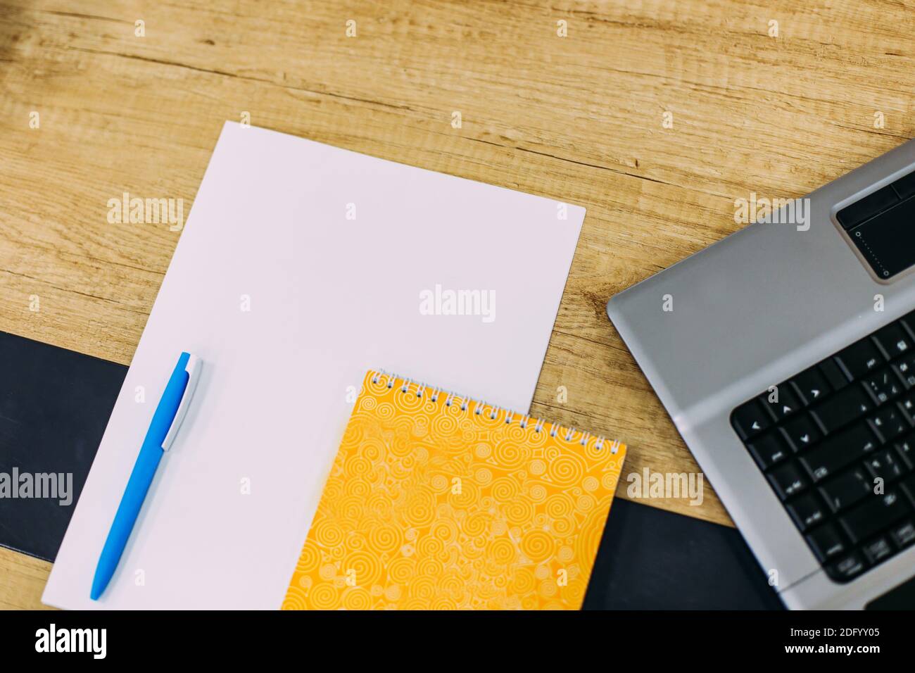 laptop and writing instruments Stock Photo - Alamy