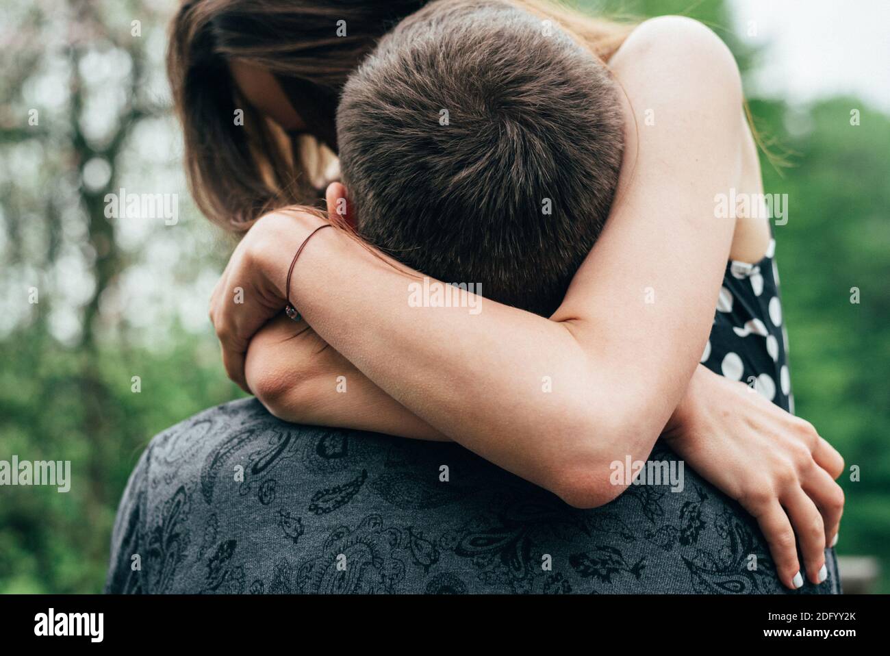 girl clasped hands on the neck of her boyfriend, hugging him Stock ... girl clasped hands on the neck of her boyfriend, hugging him Stock ...