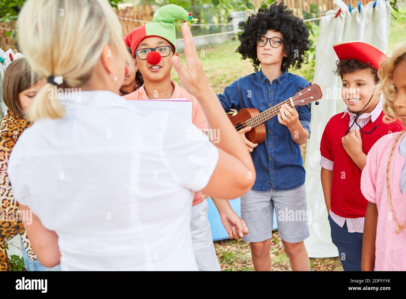 Children practice together for performance on talent show at summer ...