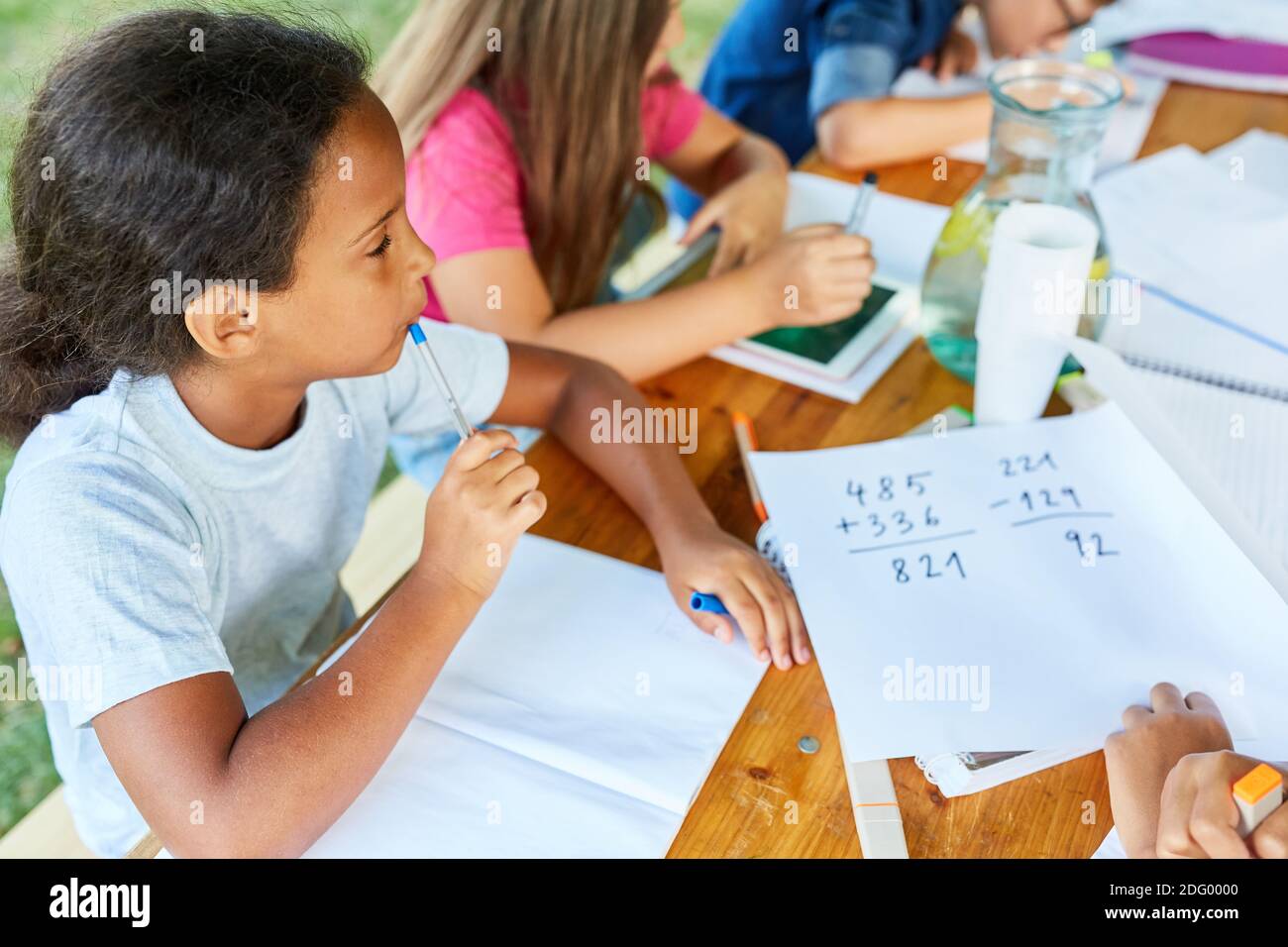 Children learn arithmetic in private lessons in the summer school ...