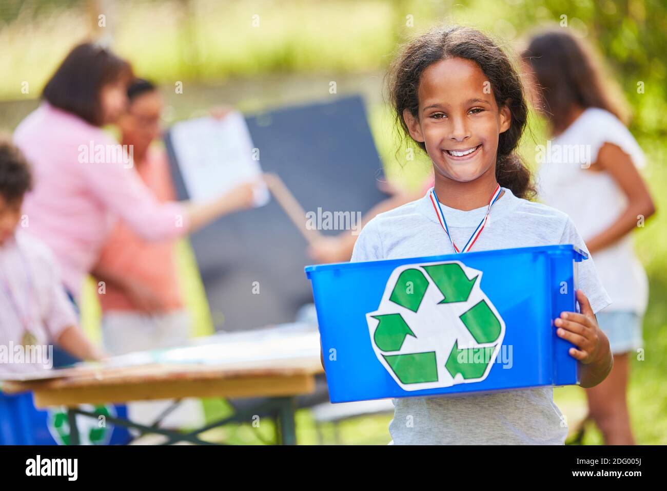 Happy kids team recycling hi-res stock photography and images - Alamy