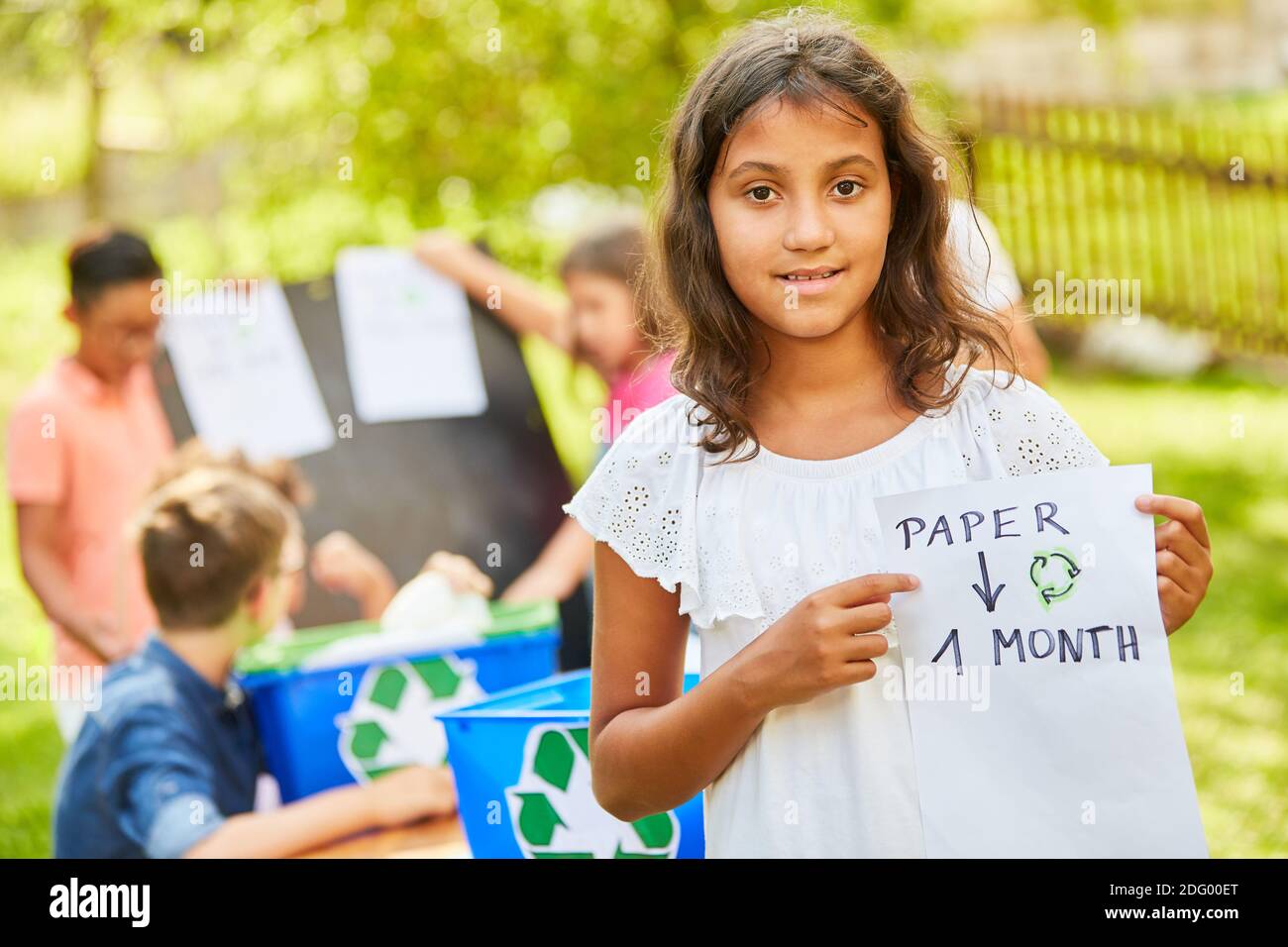 Girls and friends at a recycling campaign in the ecological summer camp ...
