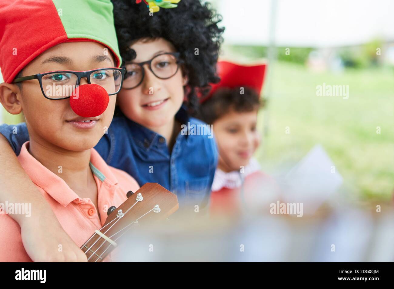 Children in funny disguise at talent show appearance in carnival or ...