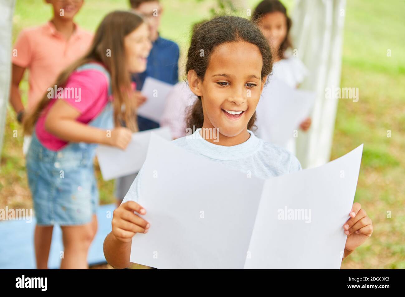 Girl singing at talent show hi-res stock photography and images - Alamy