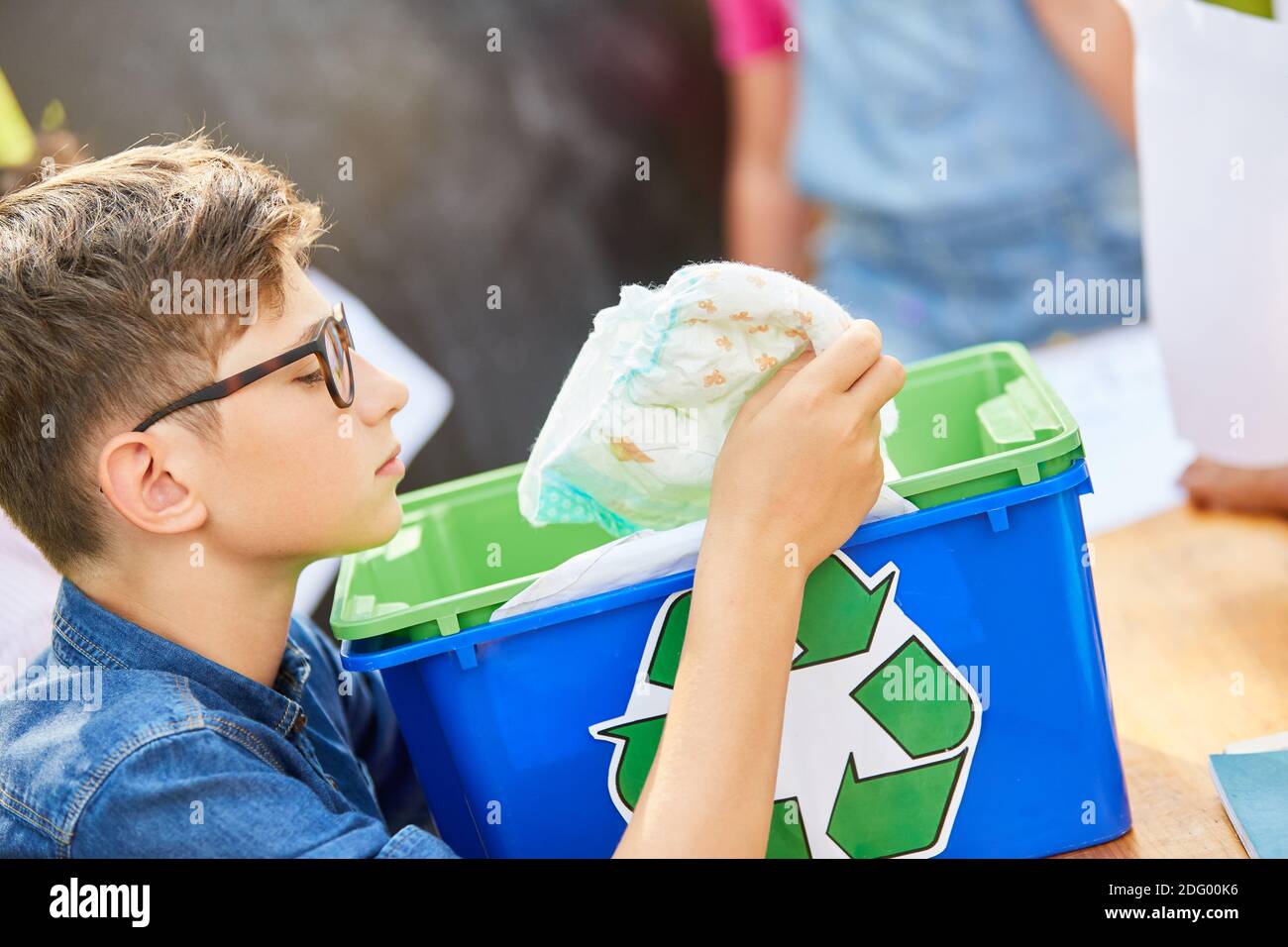 Boy with plastic waste in the ecological holiday camp during a waste ...