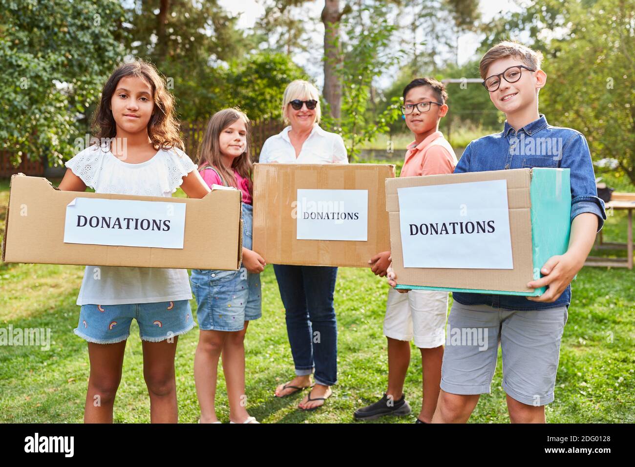 Children as voluntary helpers collecting donations for clothing ...