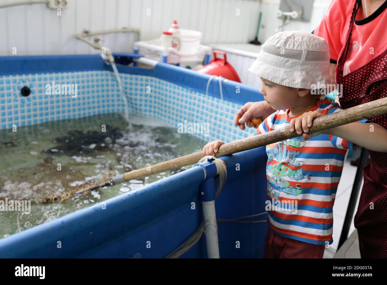 Child Catching Fish High Resolution Stock Photography and Images - Alamy