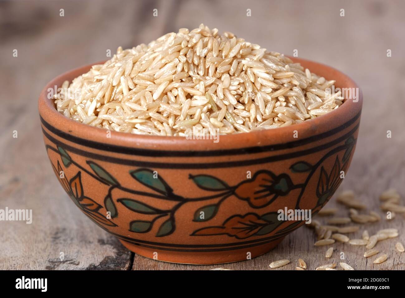 Raw brown rice in a bowl Stock Photo - Alamy
