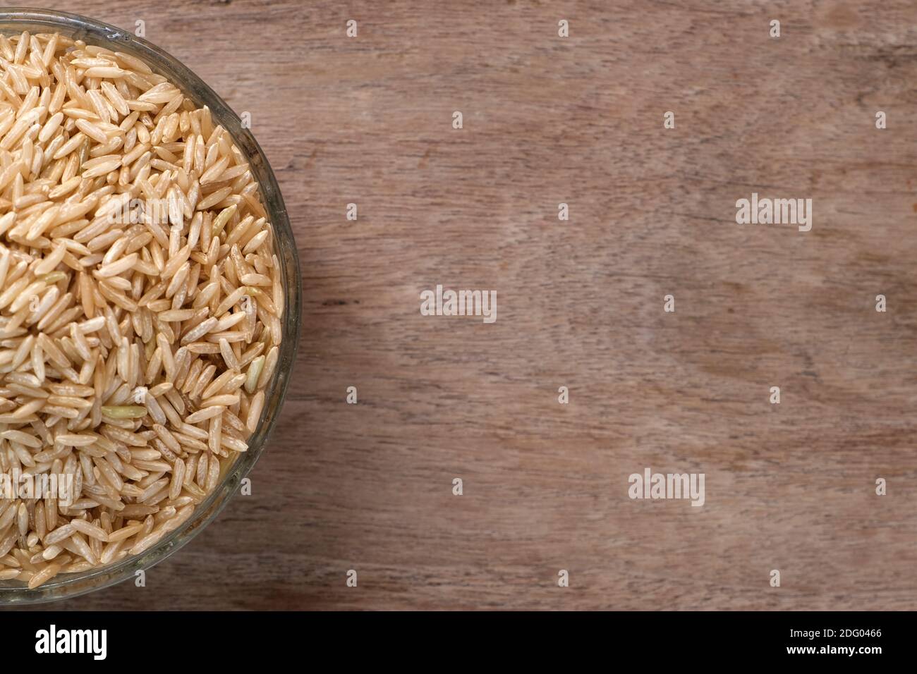Raw brown rice in a bowl Stock Photo - Alamy