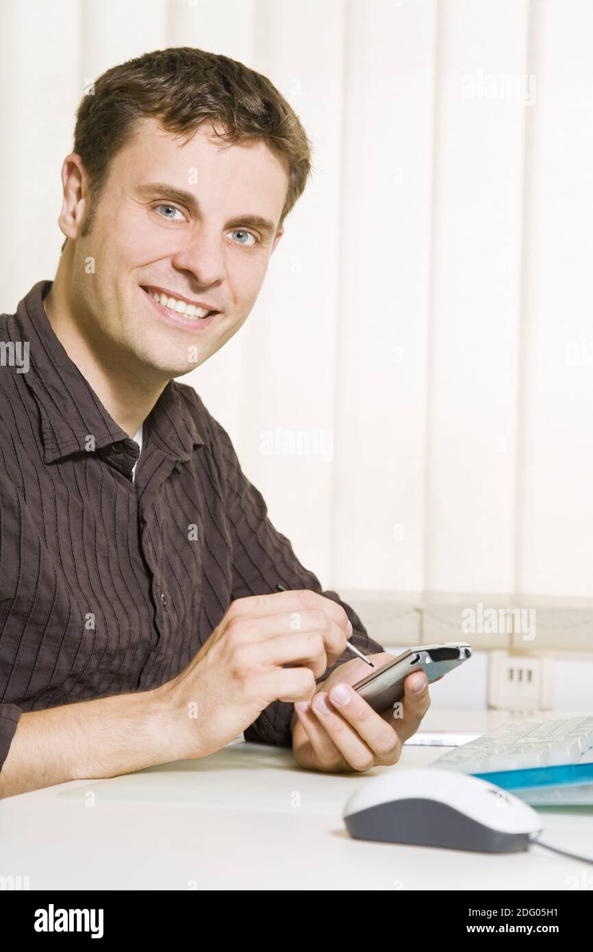 Typing on a smartphone Stock Photo - Alamy