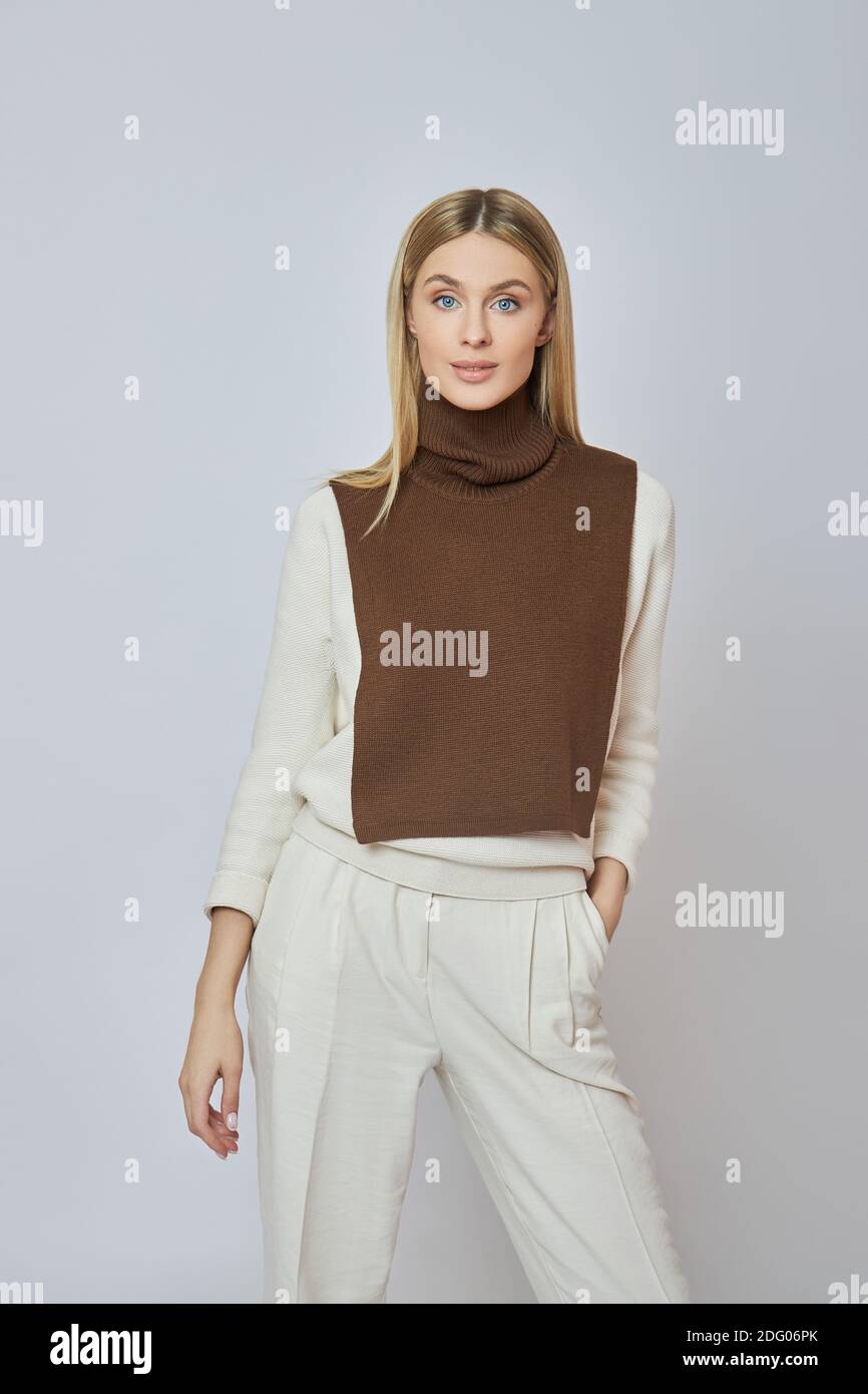 Blonde woman with a shirt front around her neck. Clothing for autumn ...