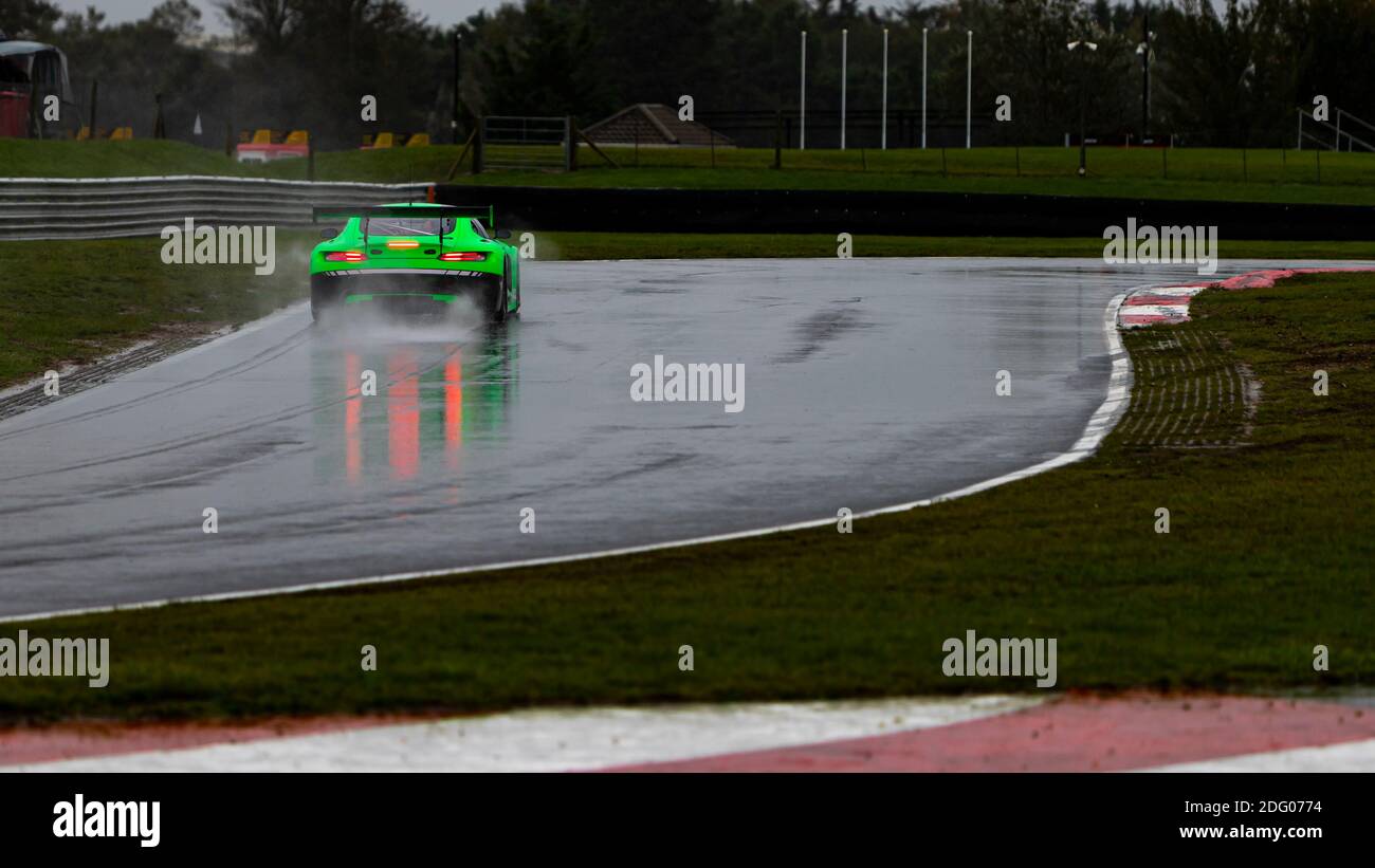 A shot of a racing car as it circuits a track Stock Photo - Alamy