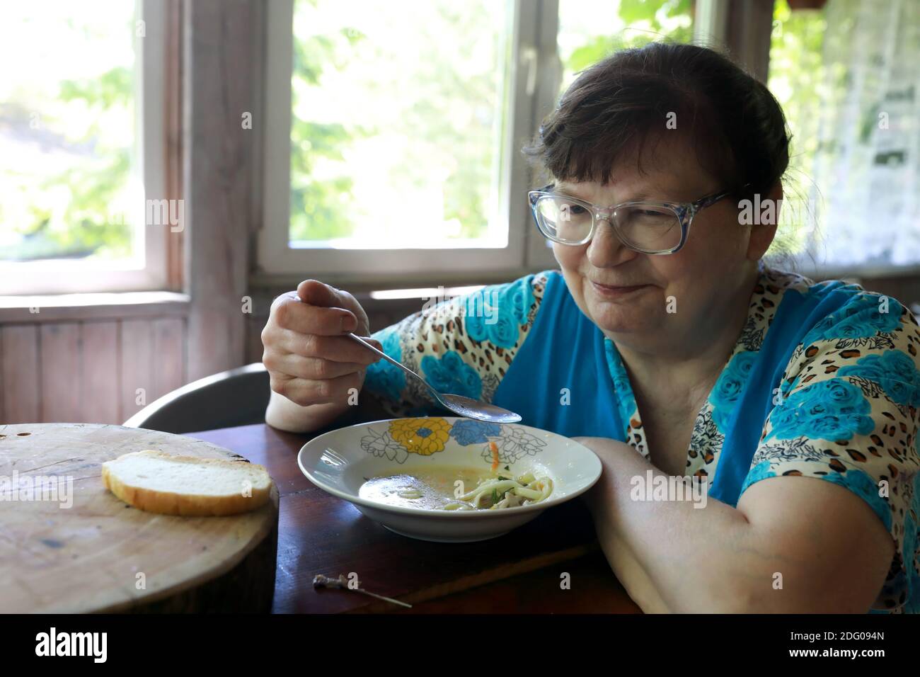 Woman senior eating soup hi-res stock photography and images - Alamy