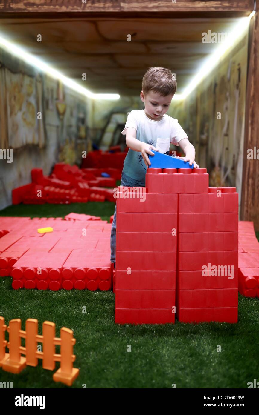 Boy building house from elements of constructor Stock Photo - Alamy