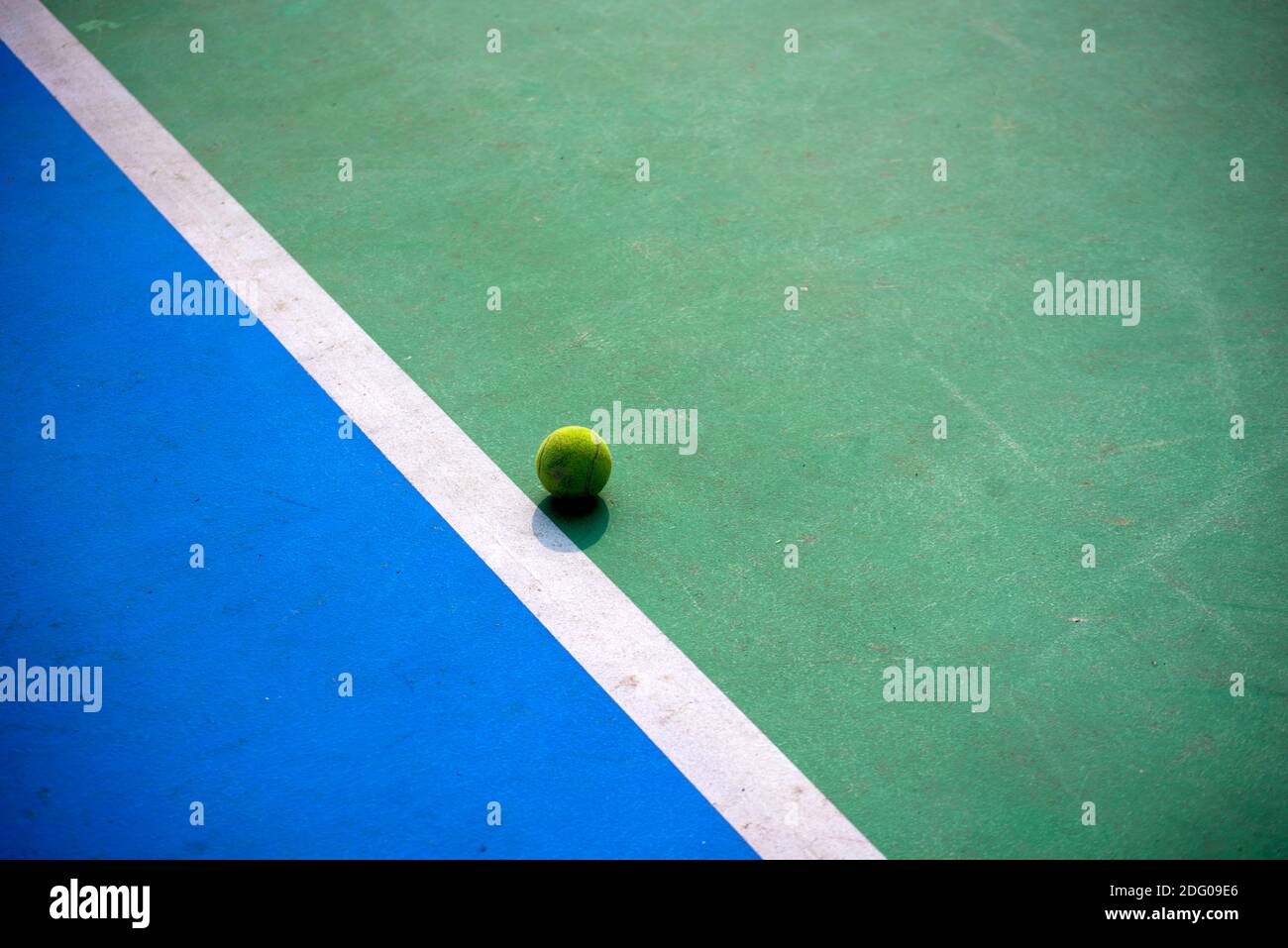 Tennis balls on the tennis court. Tennis ball out of tennis court ...