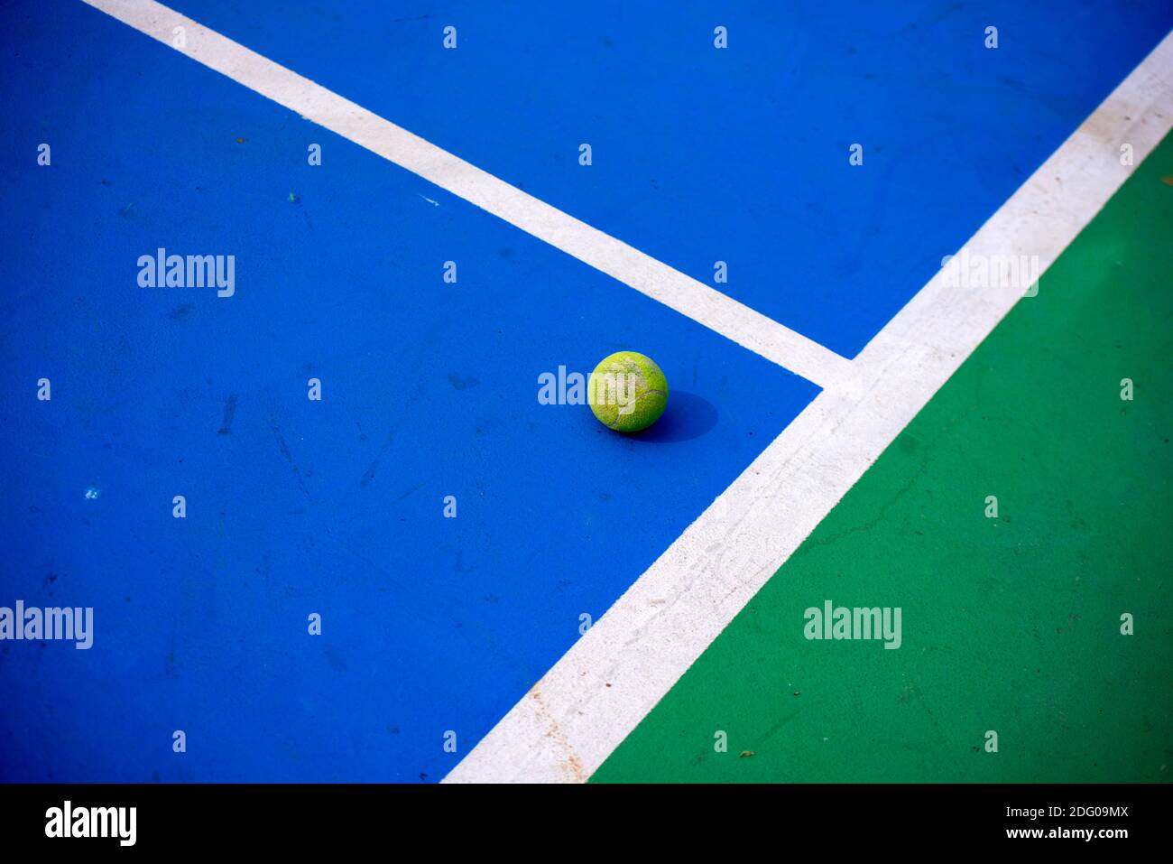 Tennis balls on the tennis court. Tennis ball out of tennis court ...