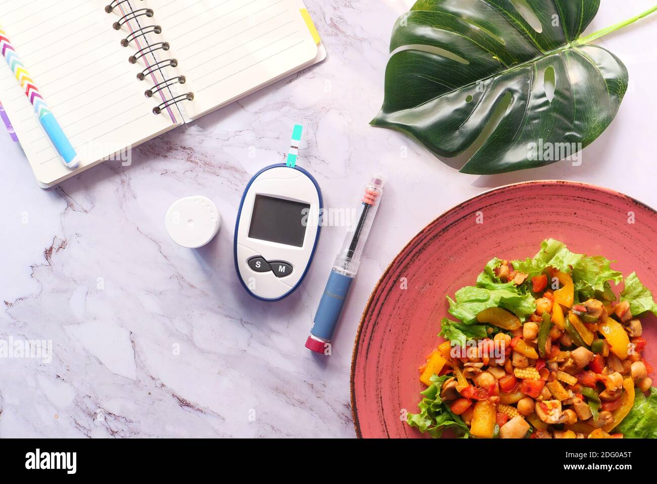 diabetic measurement tools and insulin pen and healthy food on table ...