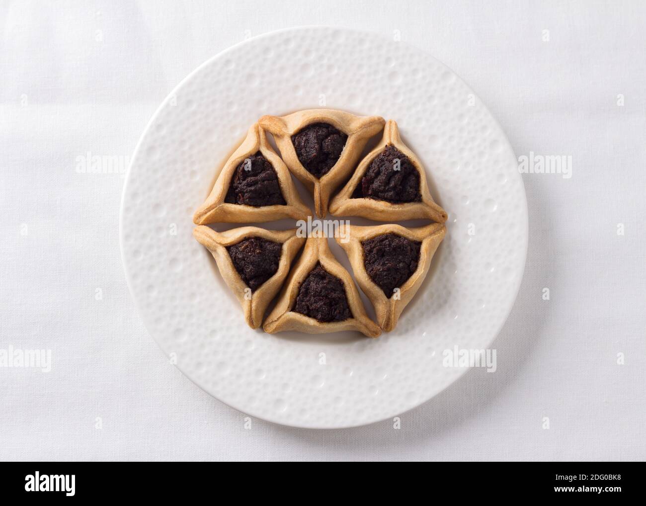 Traditional sweets for Jewish holiday of Purim. Hamantashen cookies or ...