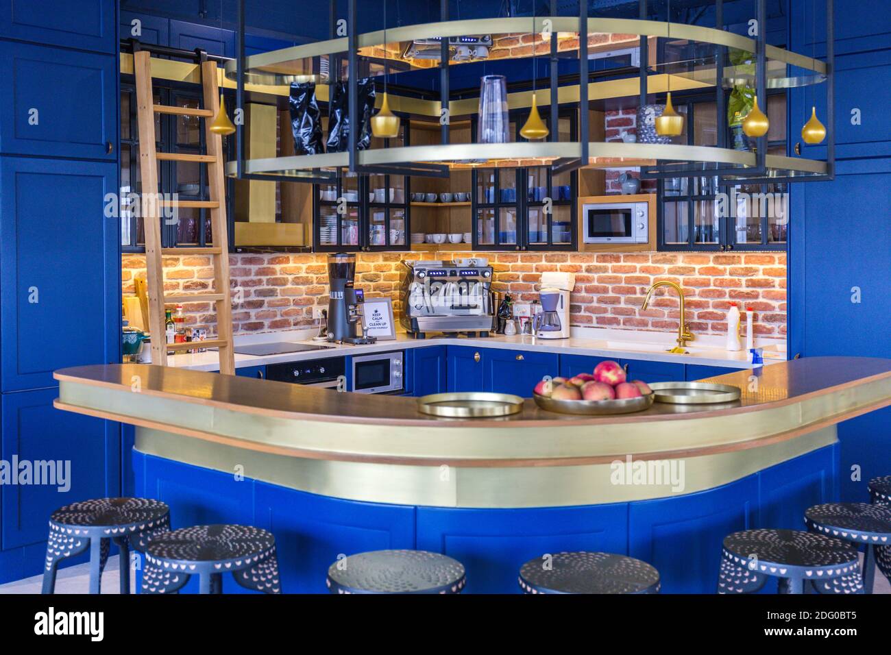Modern kitchen, with club chairs and bar, blue combination Stock Photo ...