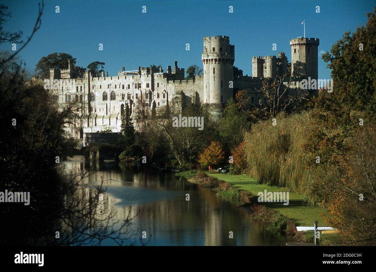 Warwick Castle by the River Avon seen in the November sunshine Stock ...