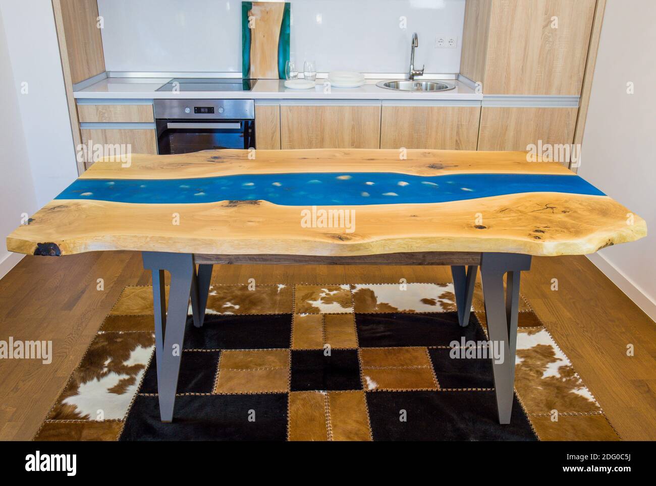 Modern tables in environment with modern kitchen, resin table Stock ...