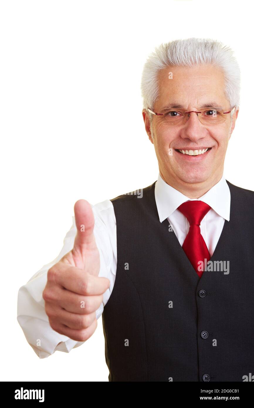 Senior points with thumb up Stock Photo - Alamy