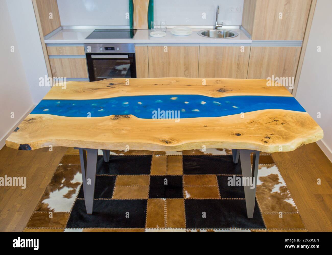 Modern tables in environment with modern kitchen, resin table Stock ...