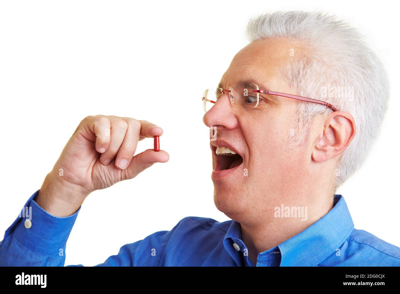 Swallow the red pill Stock Photo - Alamy