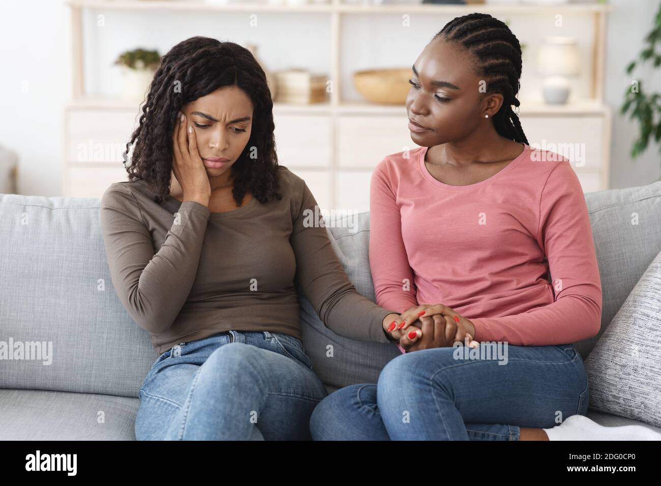 African american lady comforting her sick girlfriend Stock Photo - Alamy