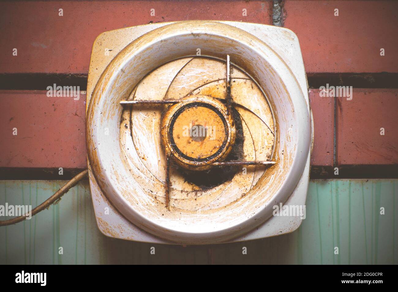 Dirty kitchen exhaust fanwith a dirty wire. Dirty oiled kichen ...