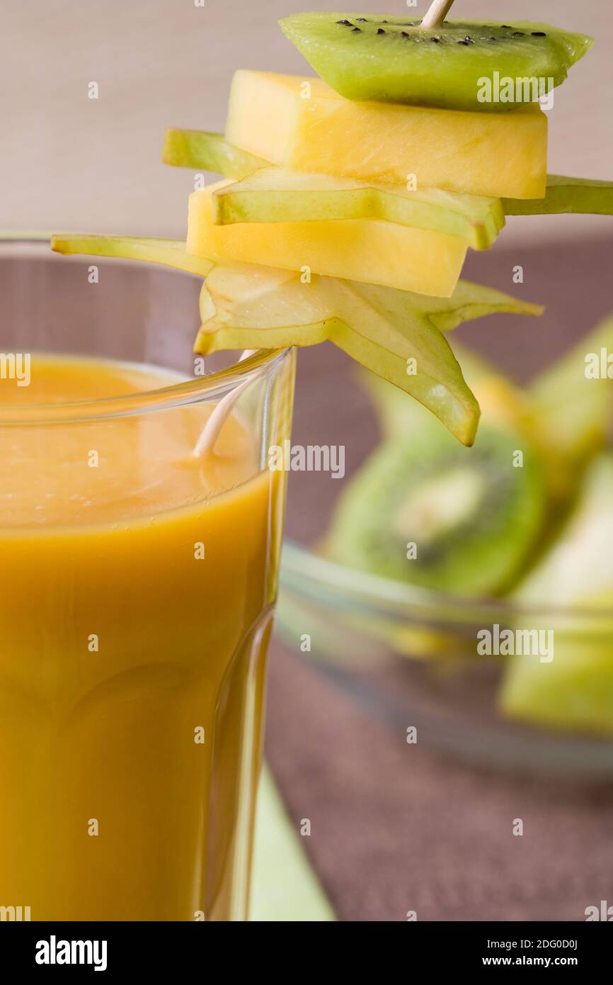 Vitamin Cocktail mit FruchtspieÃŸ - Smoothie with tropical fruits Stock ...