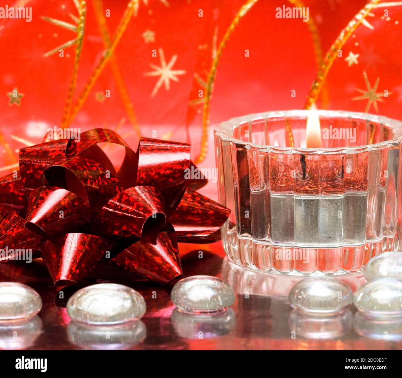 Festive candles with red bow Stock Photo - Alamy