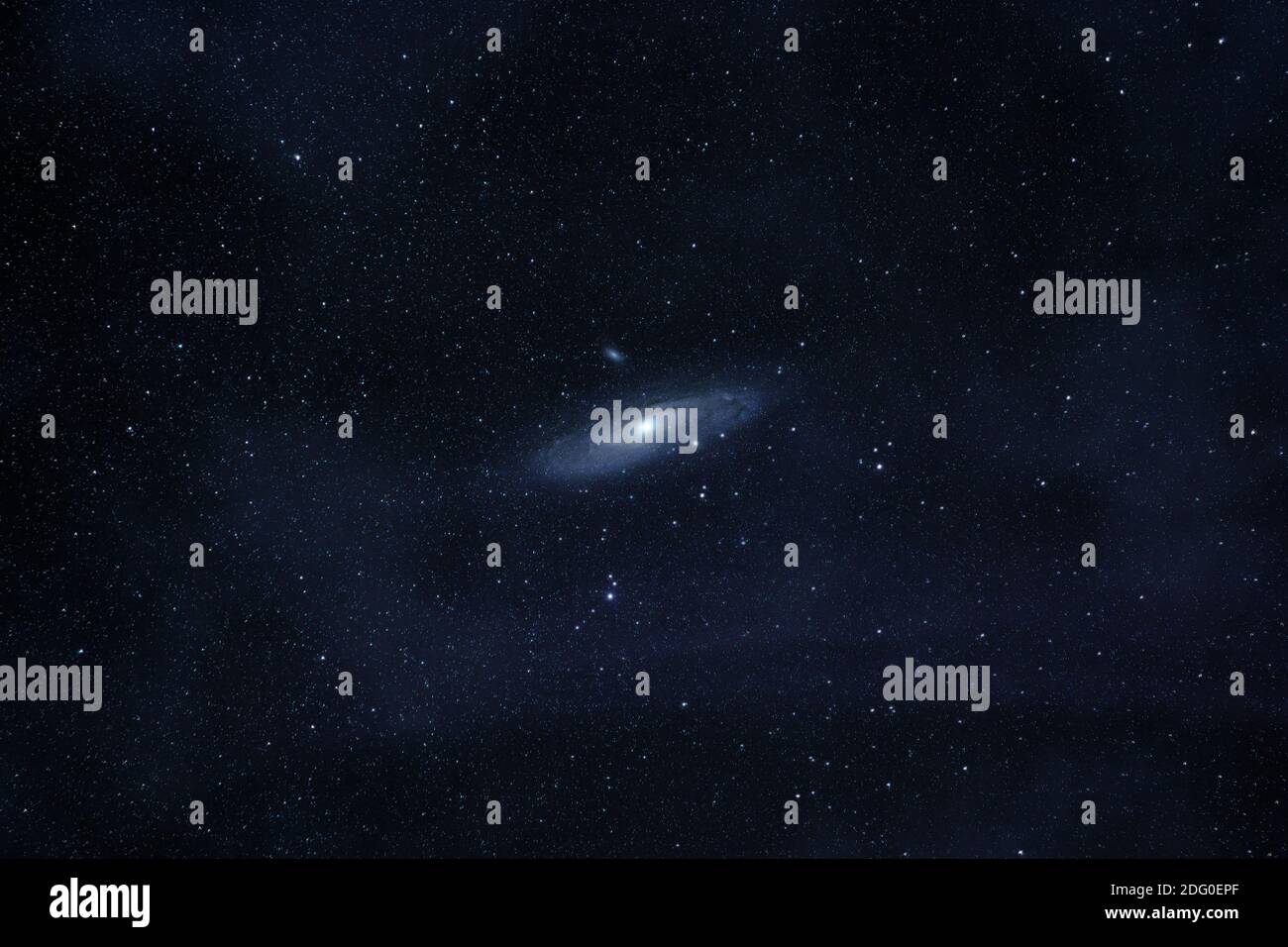 andromeda galaxy surrounded by stars with clouds in deep space with ...