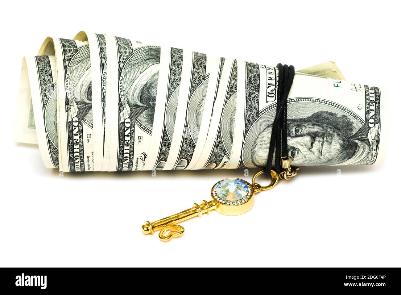 Golden key and dollars isolated on white Stock Photo - Alamy