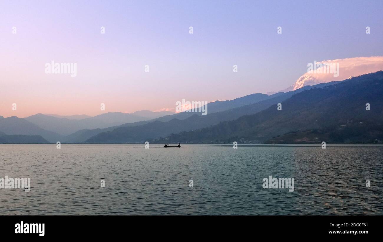 Phewa Lake with Annapurna Range in Pokhara, Nepal. People enjoying ...