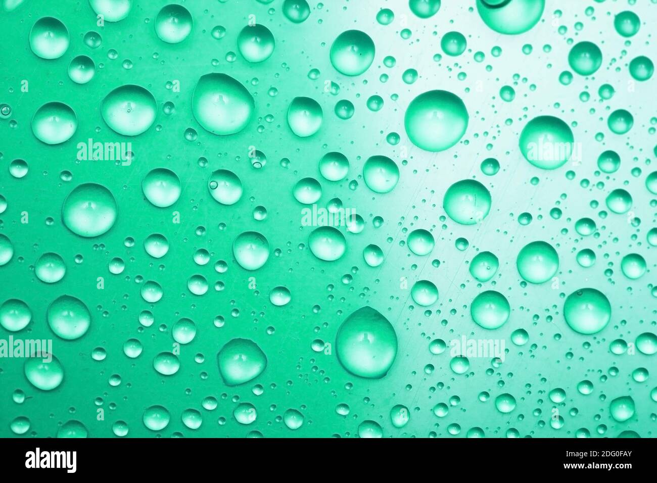 Green water drops for background Stock Photo - Alamy