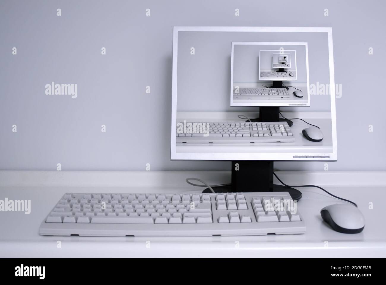 PC with computers on desktop Stock Photo - Alamy