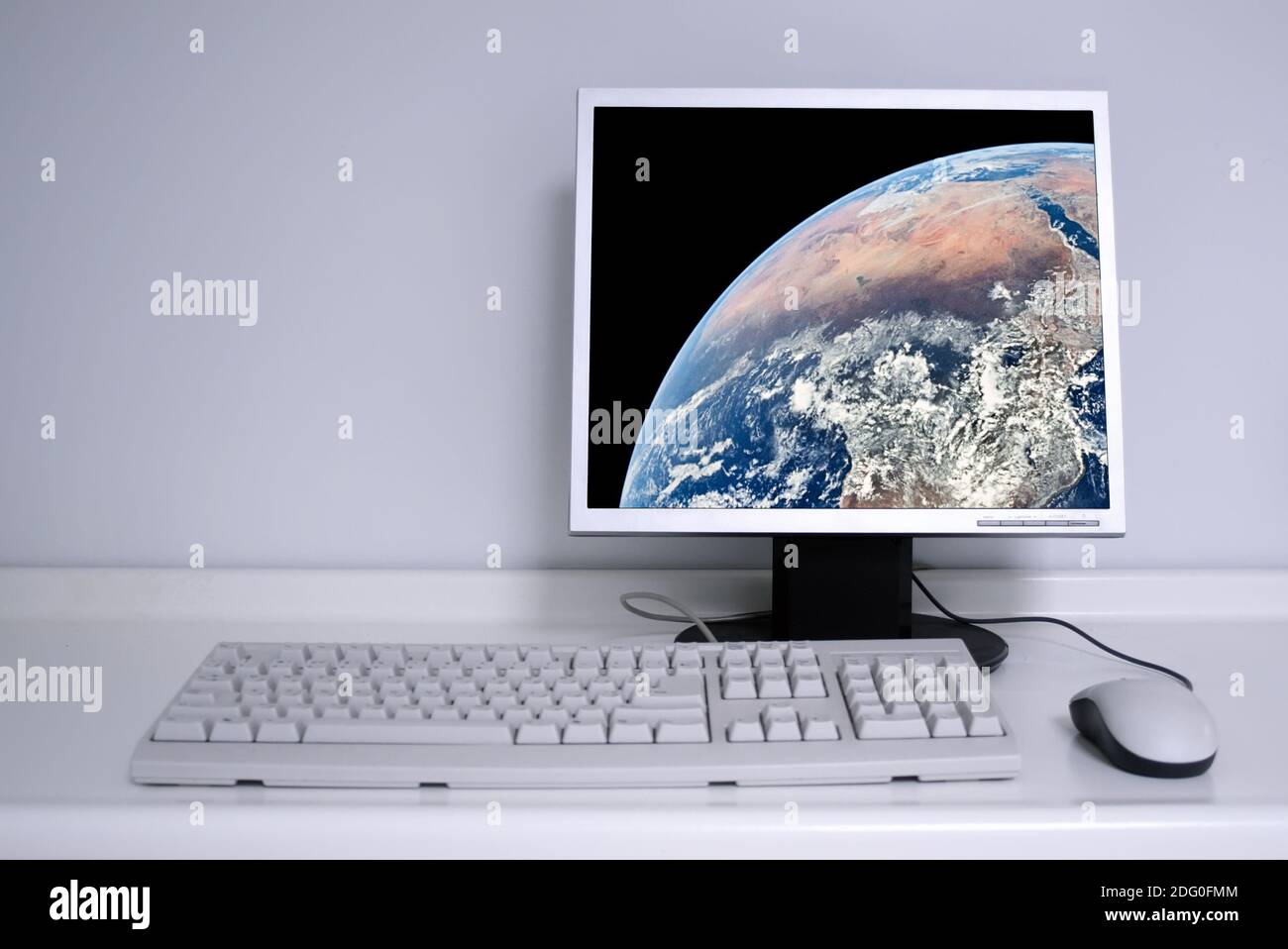 PC with earth on desktop Stock Photo - Alamy