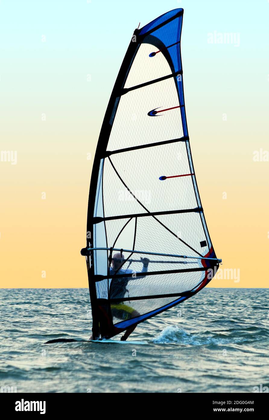 Windsurfer on waves of a sea Stock Photo - Alamy