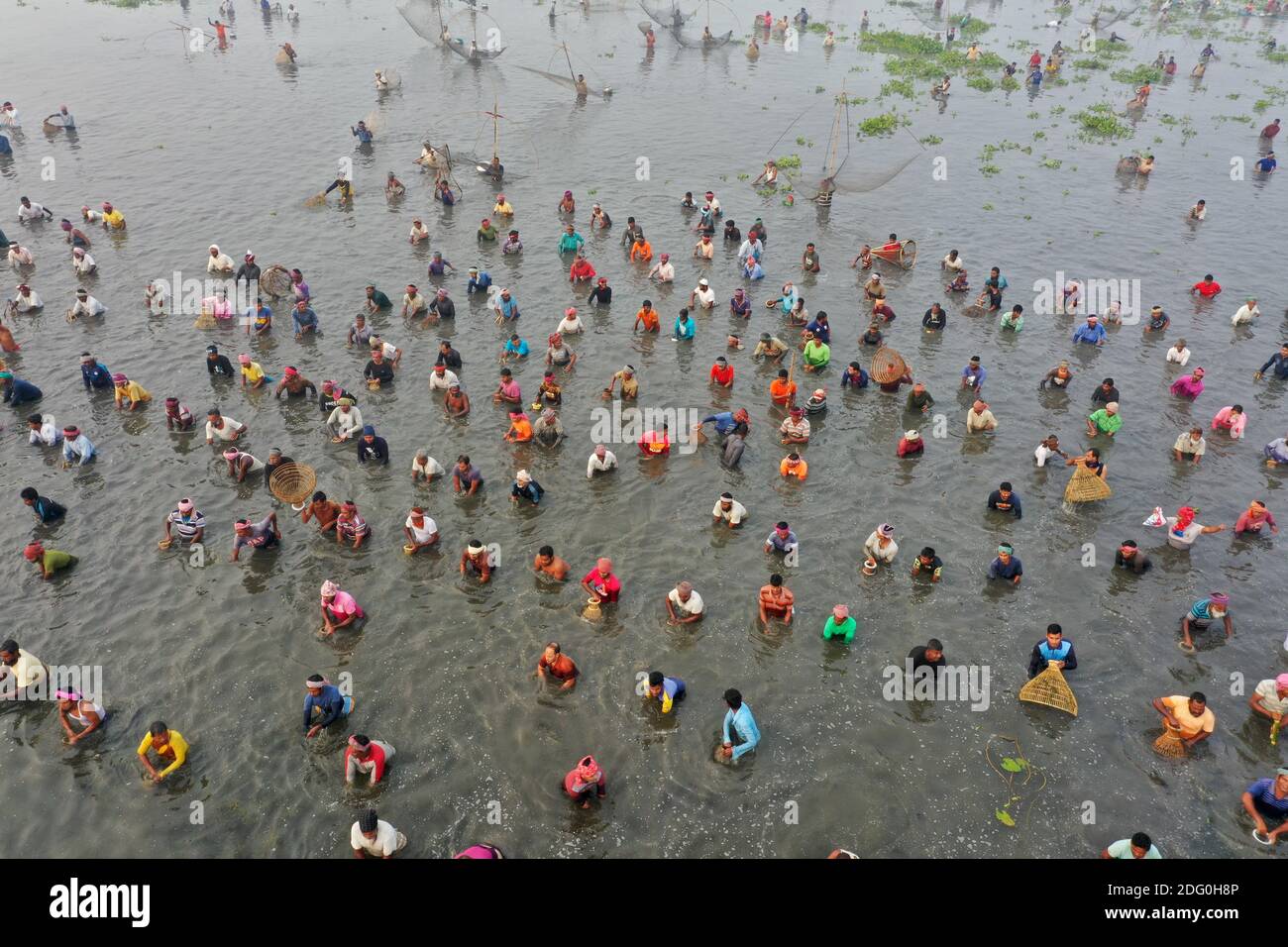 Pabna, Bangladesh - December 05, 2020: Thousands of fishermen gathered at Dikshir Beel in ...